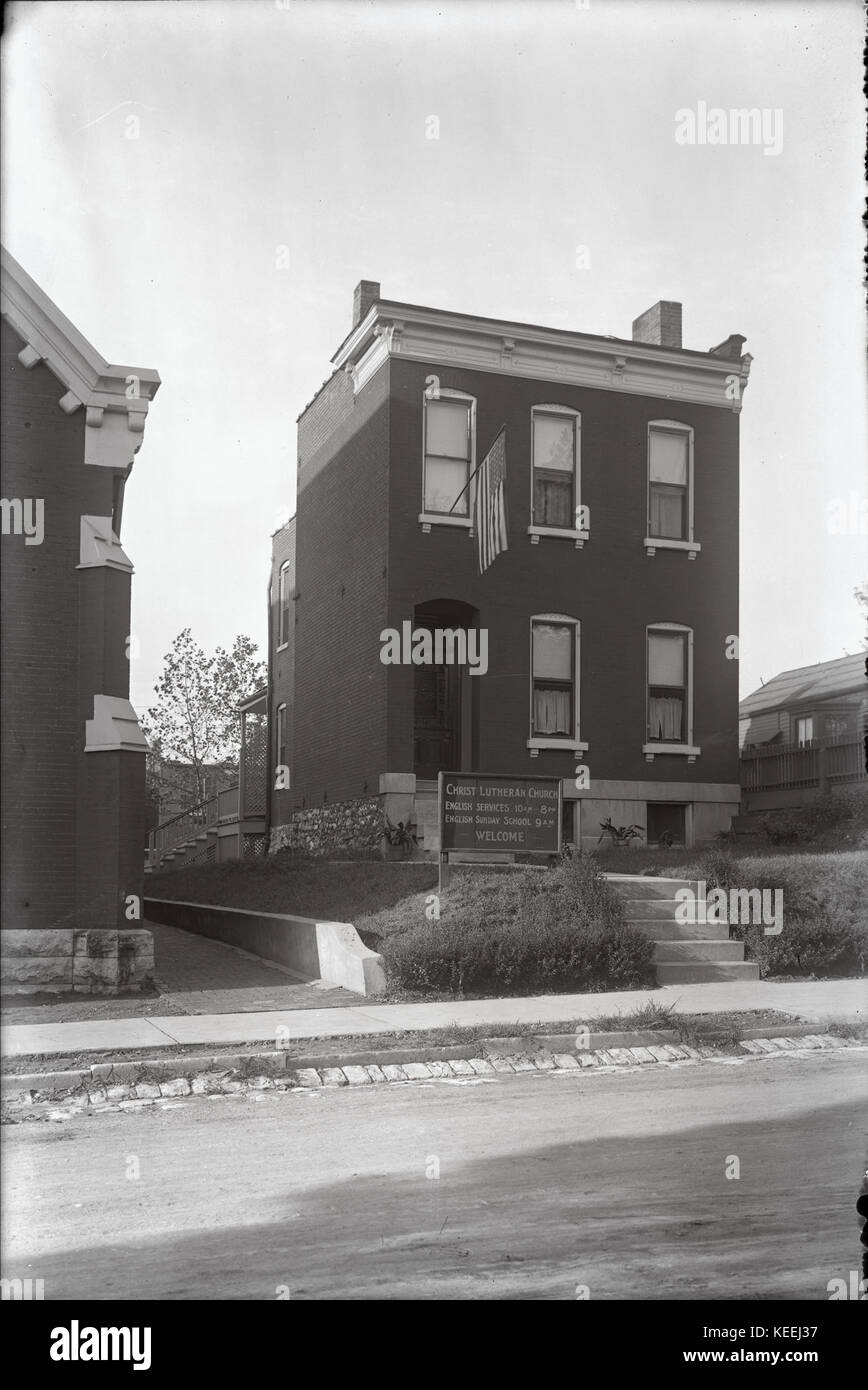 Two story house with Christ Lutheran Church. English Services on sign ...