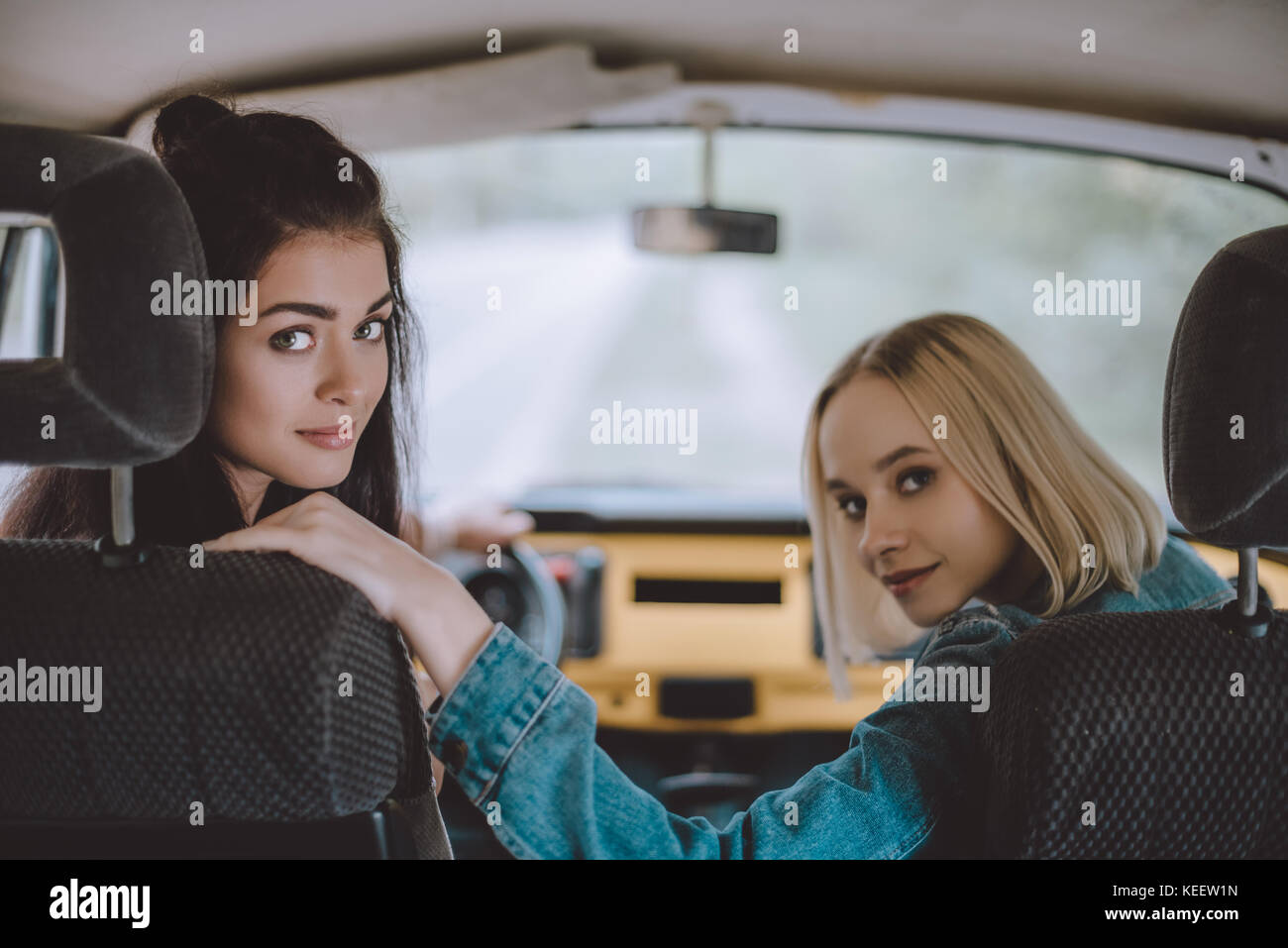 beautiful young girls having road trip in minivan together Stock Photo ...