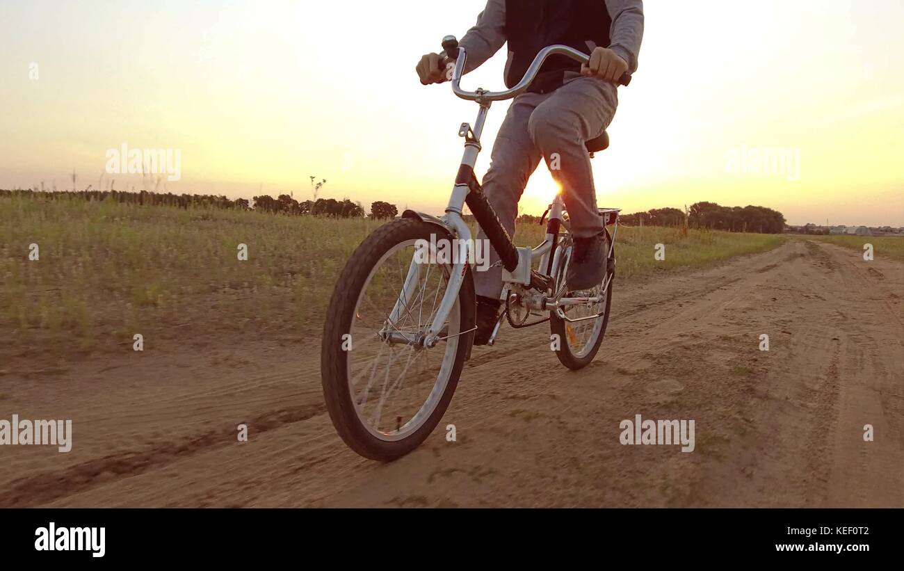 Boy teenager riding a bicycle. Boy teenager riding a bicycle goes to ...
