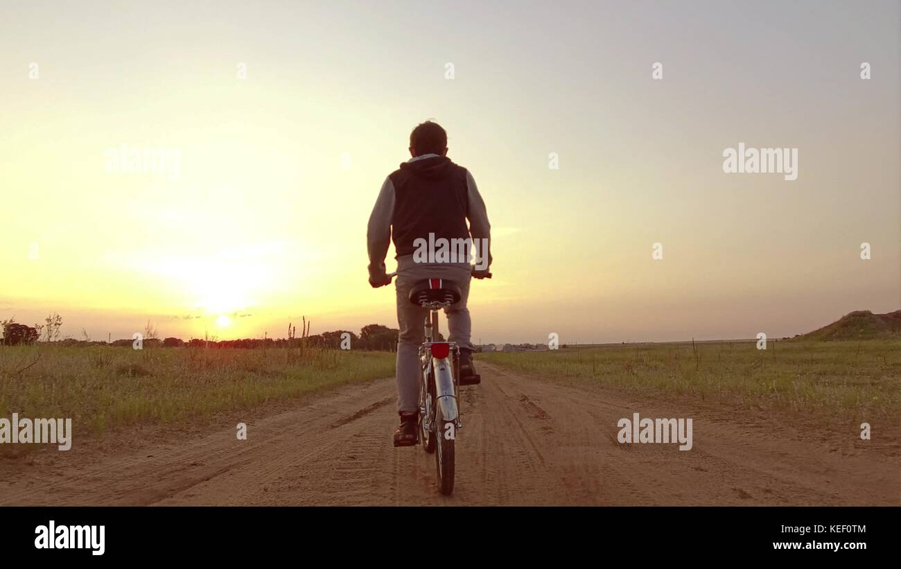 Boy teenager riding a bicycle. Boy teenager riding a bicycle goes to ...