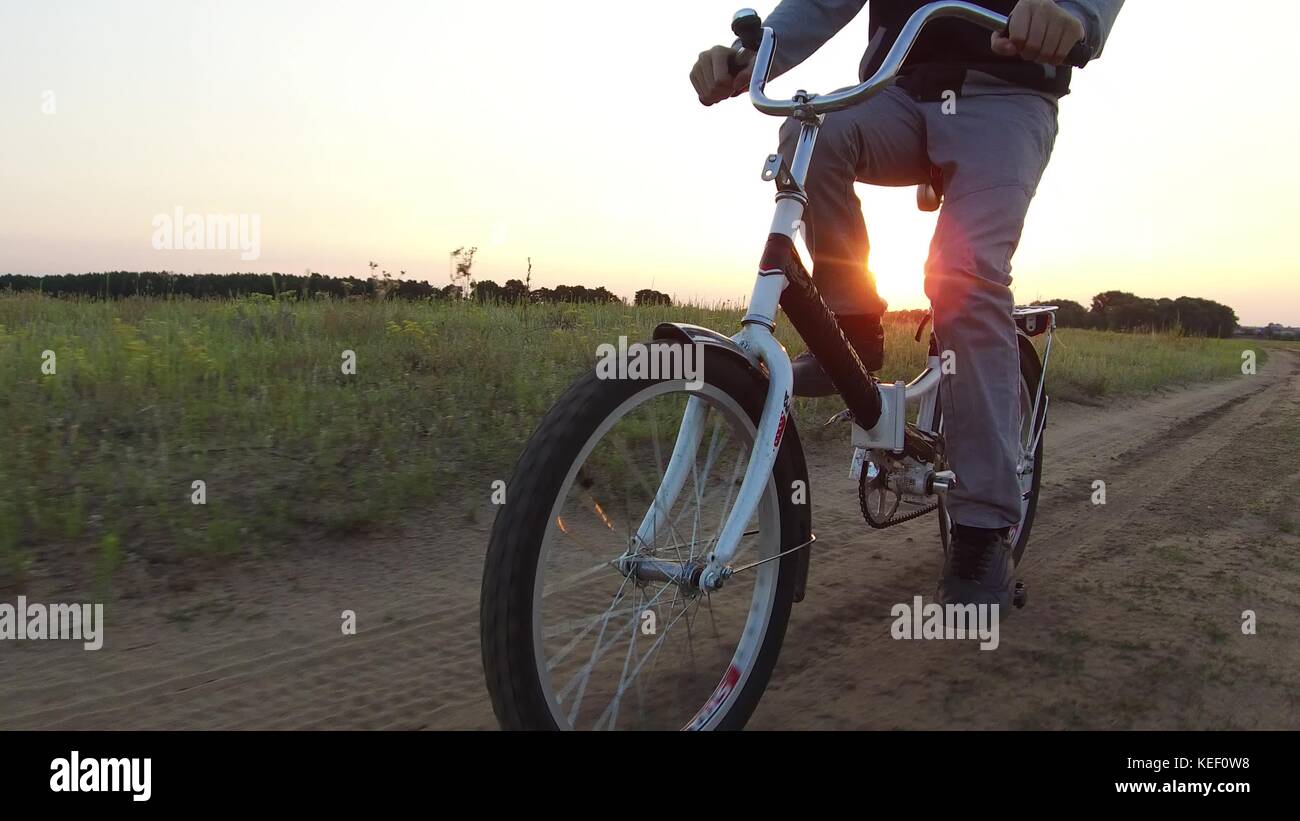 Boy teenager riding a bicycle. Boy teenager riding bicycle goes to ...