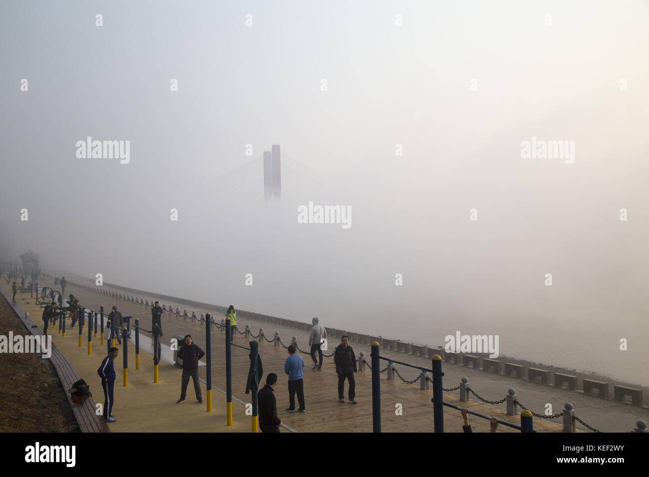 October 20, 2017 - Jilin, China - The top of a bridge can barely be ...