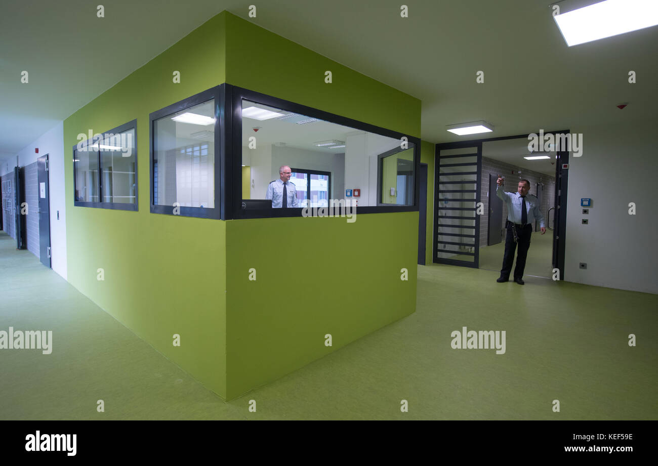 A judicial officer in a surveillance room in a new prison building at ...