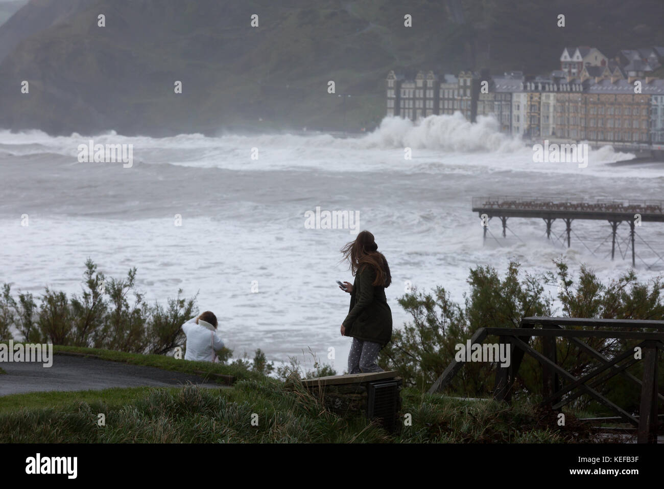 People walking in windy weather. Credit: Ian Jones/Alamy Live News ...