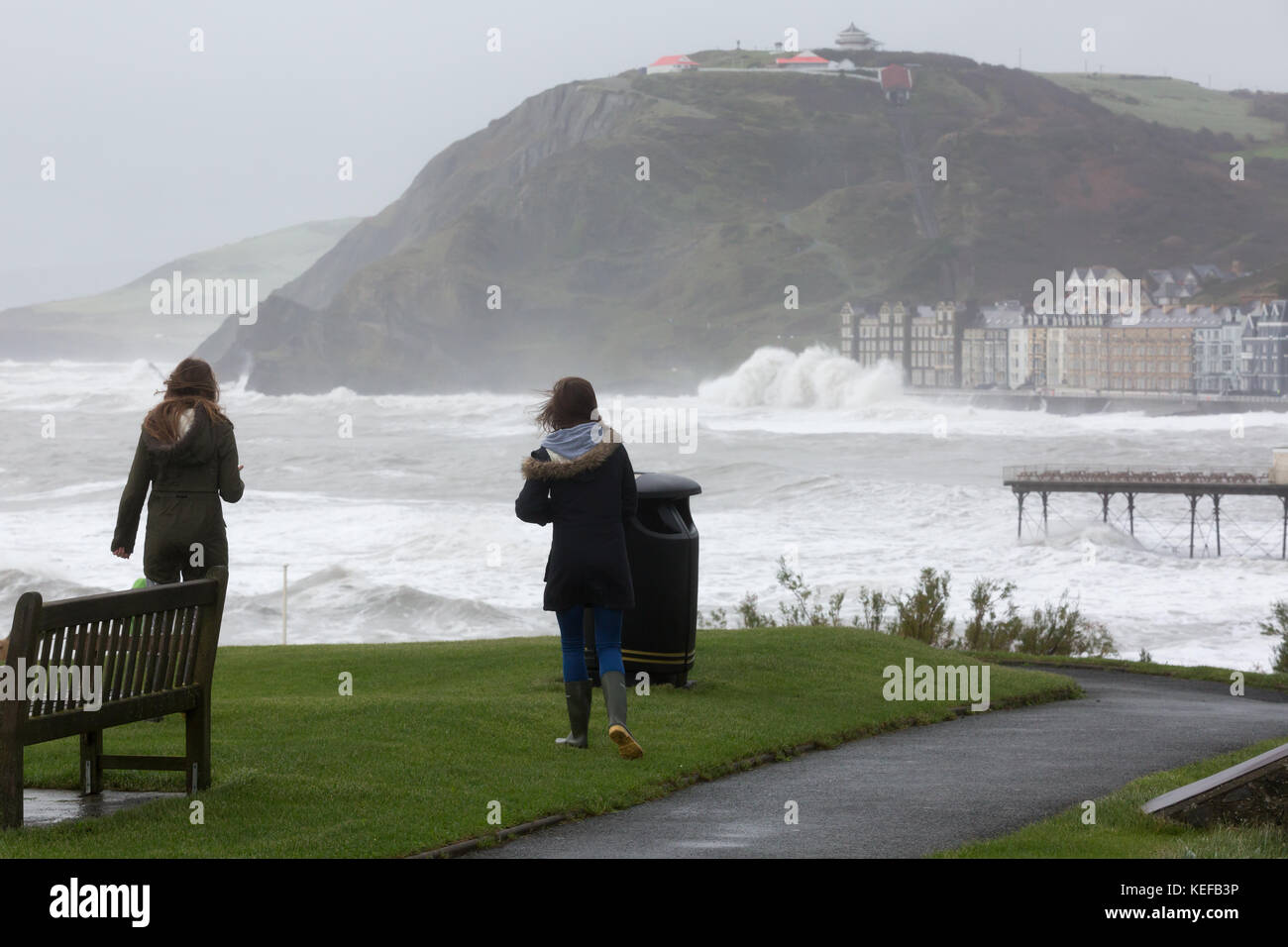 People walking in windy weather. Credit: Ian Jones/Alamy Live News ...