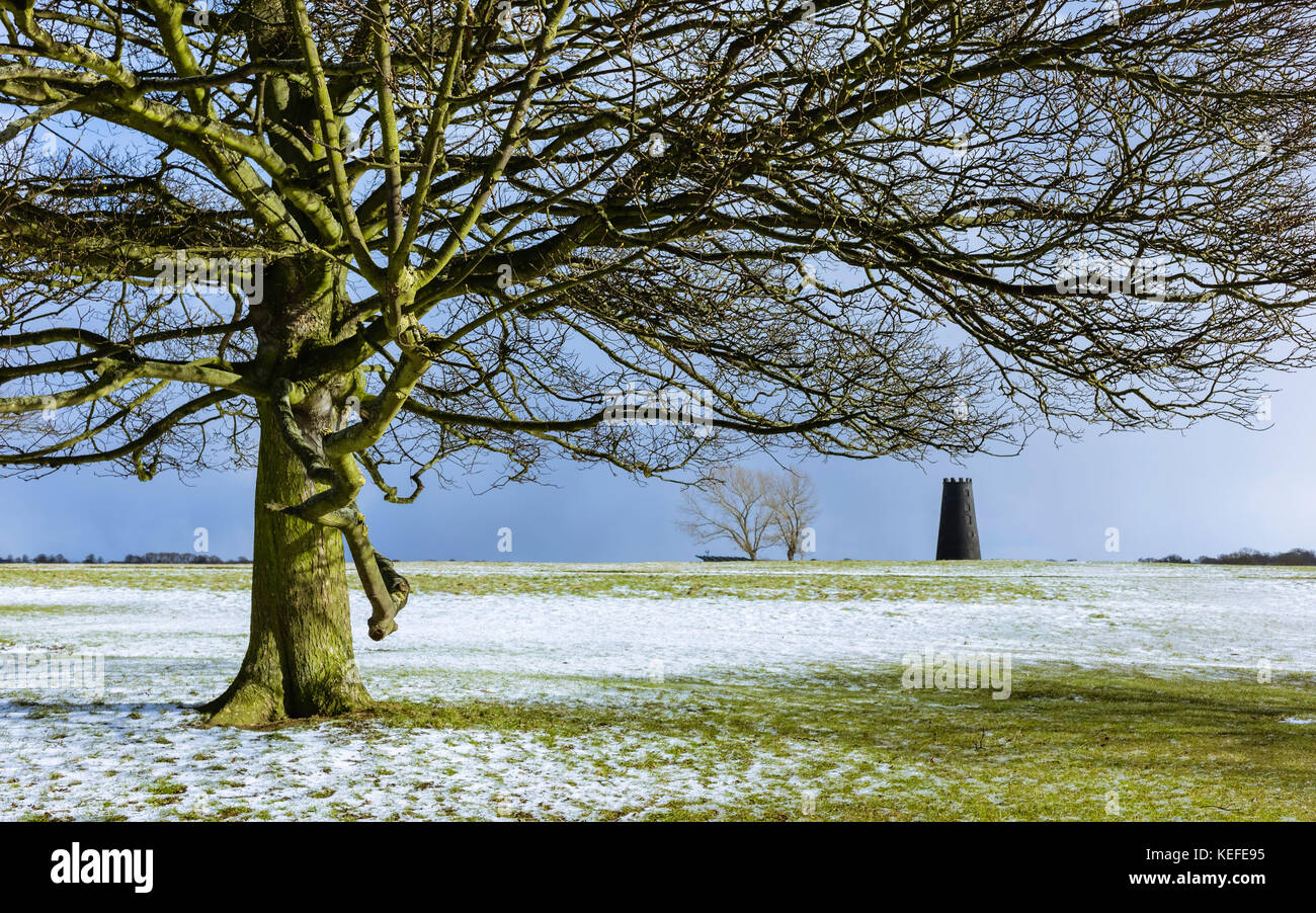 Disused windmill, the Black Monument, in the snow covered pasture of ...