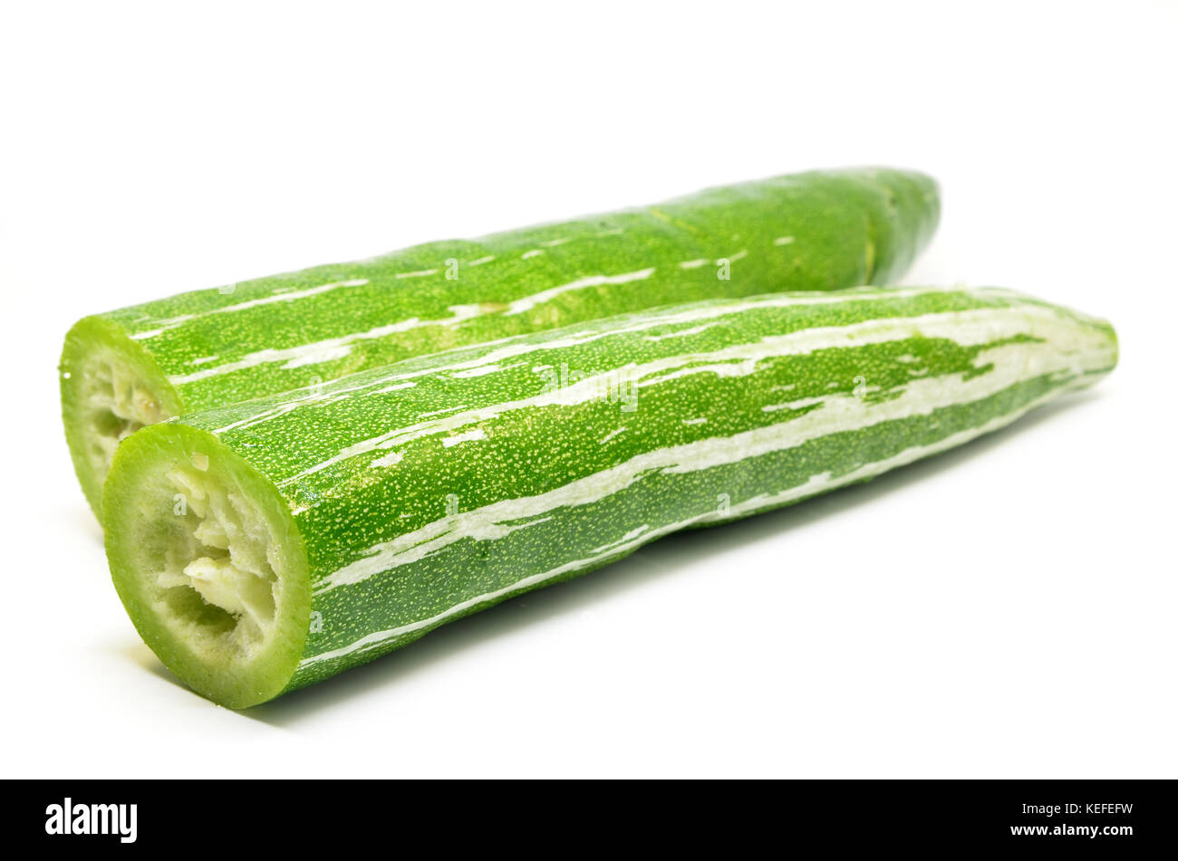 Sliced Snake gourd isolated over white background Stock Photo - Alamy