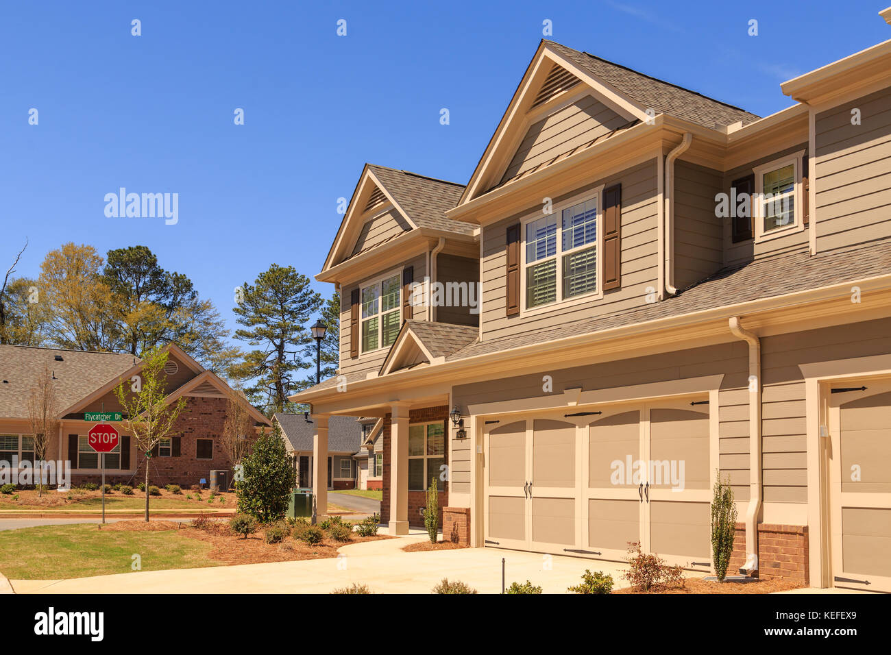 A row of modern townhouses in a new subdivision Stock Photo - Alamy
