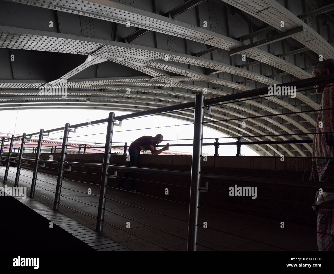 Man snapping under the bridge Stock Photo - Alamy