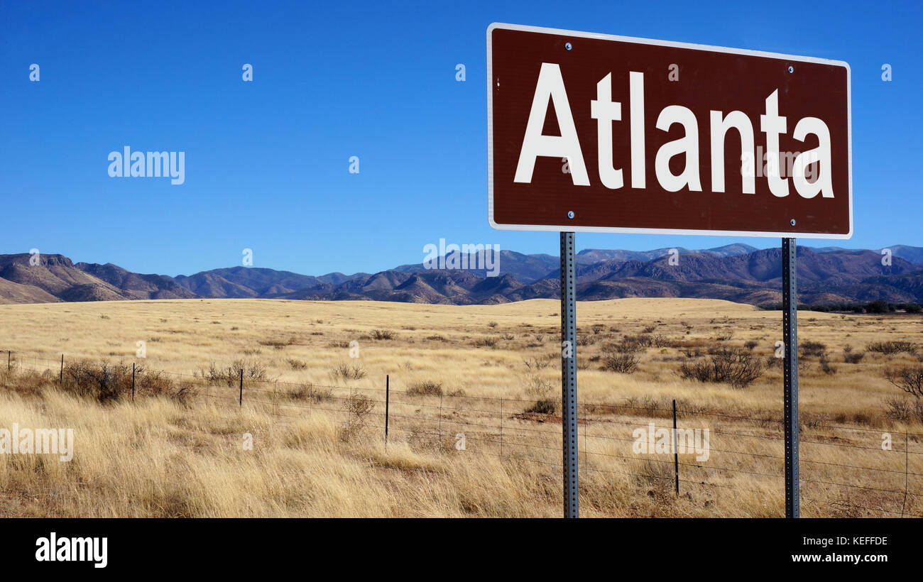 Atlanta road sign with blue sky and wilderness Stock Photo - Alamy