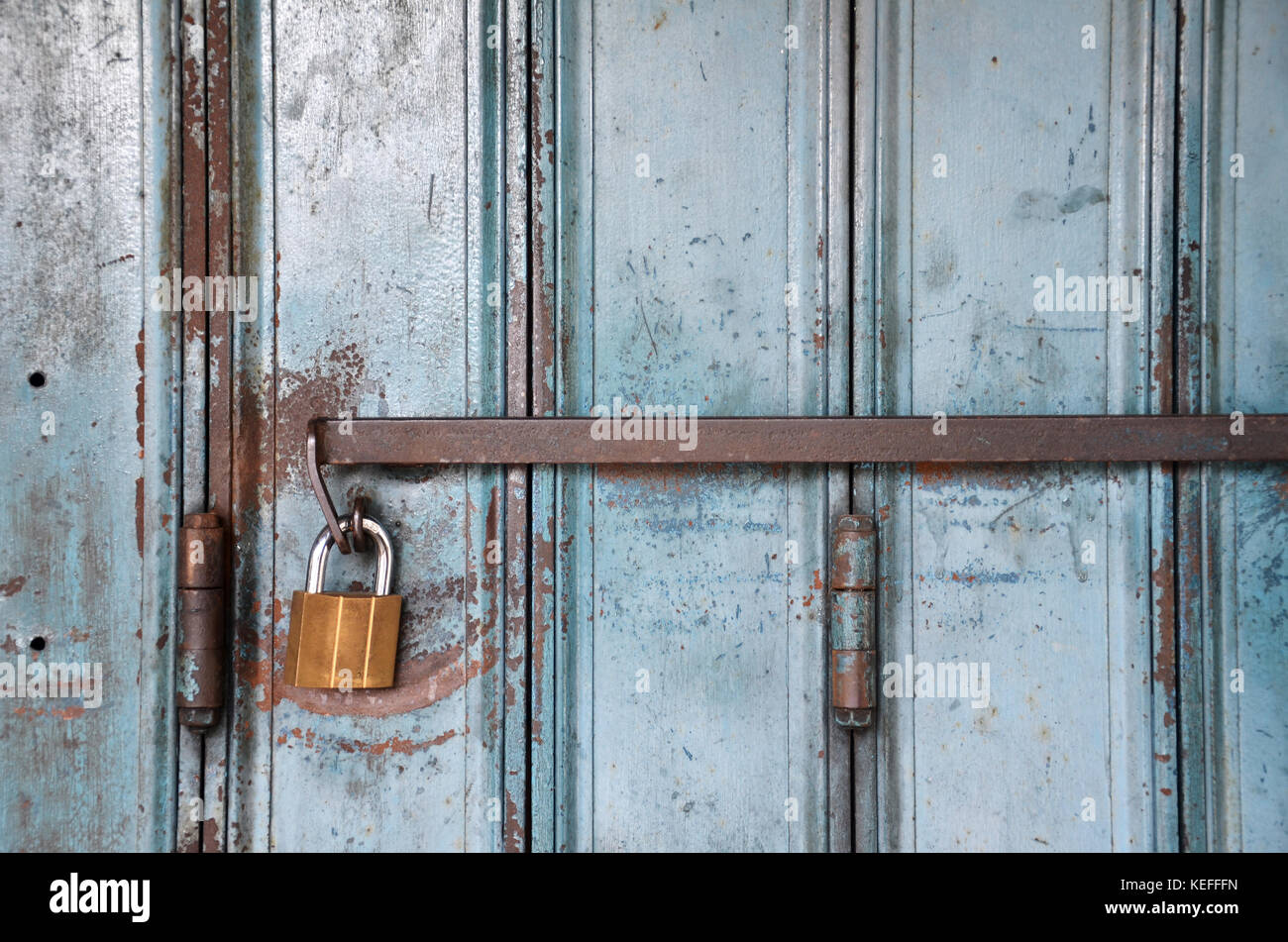 Metal lock on a blue door, vintage concept Stock Photo - Alamy