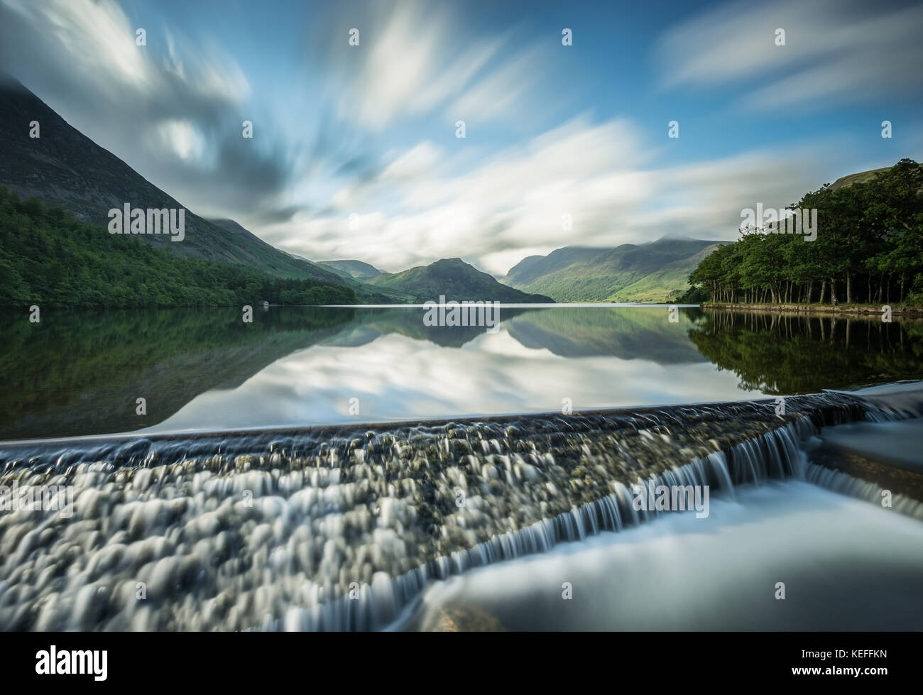 A stunning mornings reflections on Crummock Water in Cumbria Stock ...
