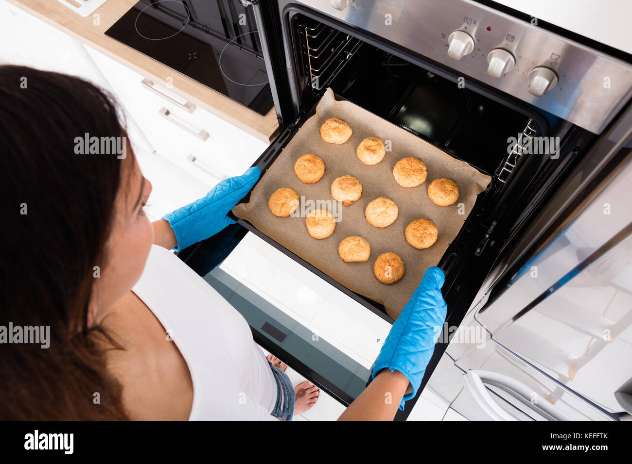 Woman baking biscuits hi-res stock photography and images - Alamy