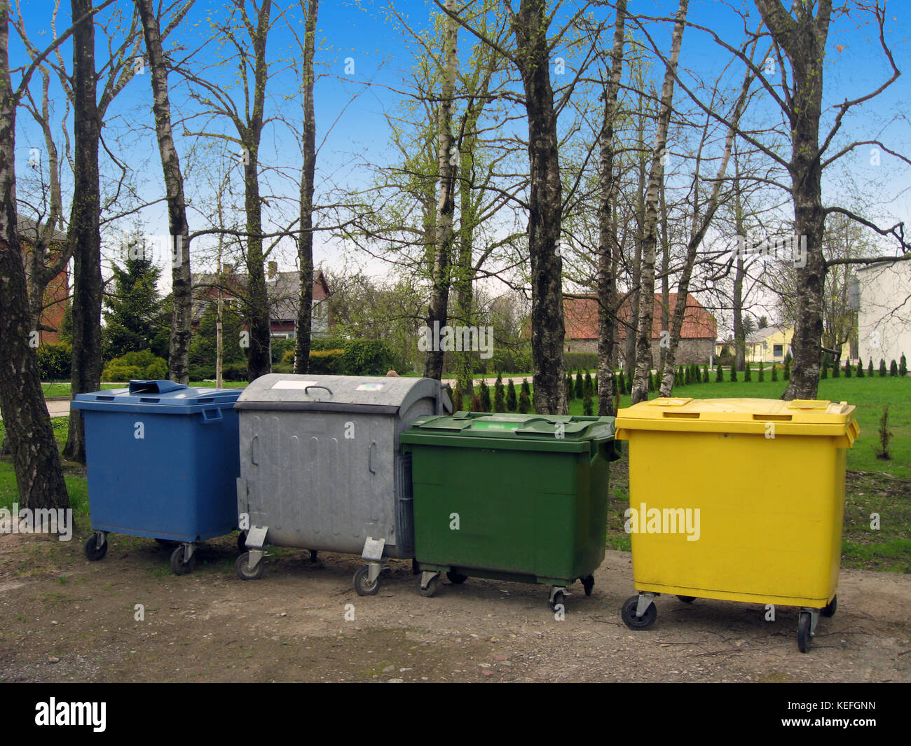 Trash containers in different color, for sorted waste Stock Photo - Alamy