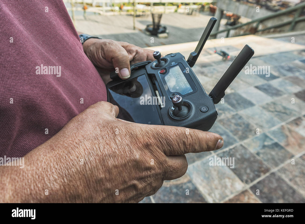 man holding drone remote control Stock Photo - Alamy