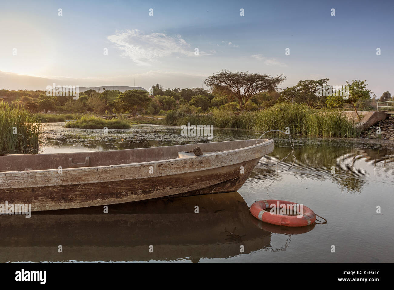 African lake with boat, sunset. Lubango. Angola Stock Photo - Alamy