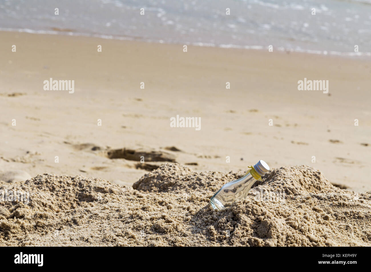 Empty glass bottle on the beach with copy space, Minimalist Stock Photo ...