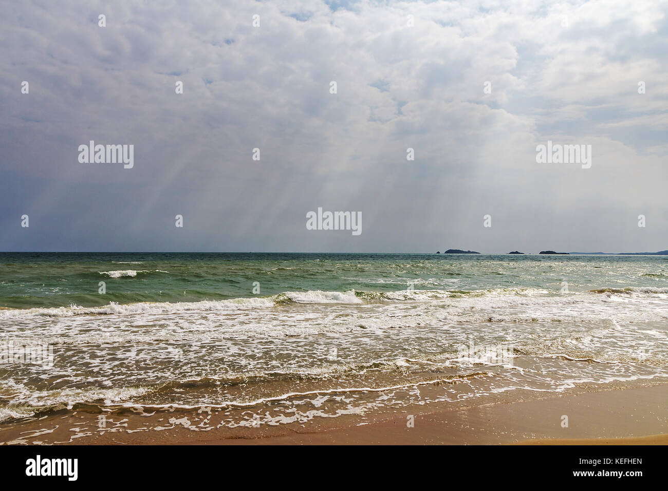 Sea and beach in cloudy day Stock Photo - Alamy