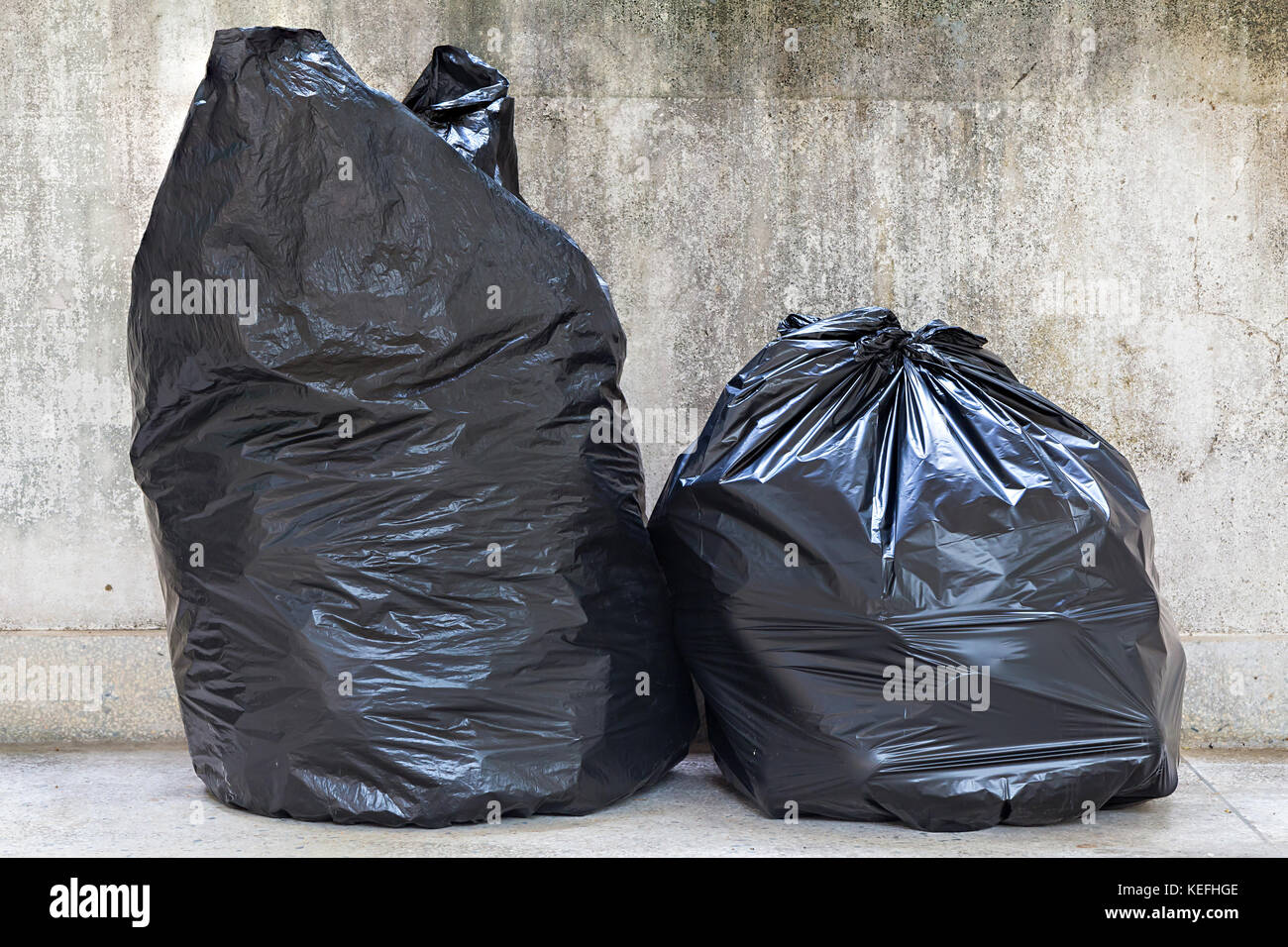 close-up of a full garbage bags on floor Stock Photo - Alamy
