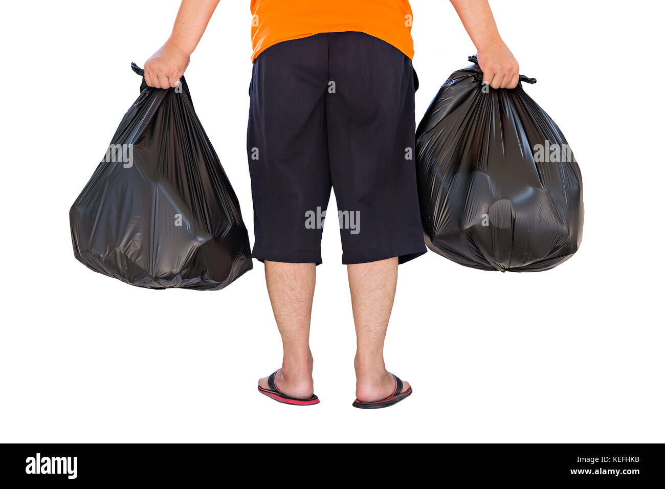 Man carrying garbage bags hi-res stock photography and images - Alamy