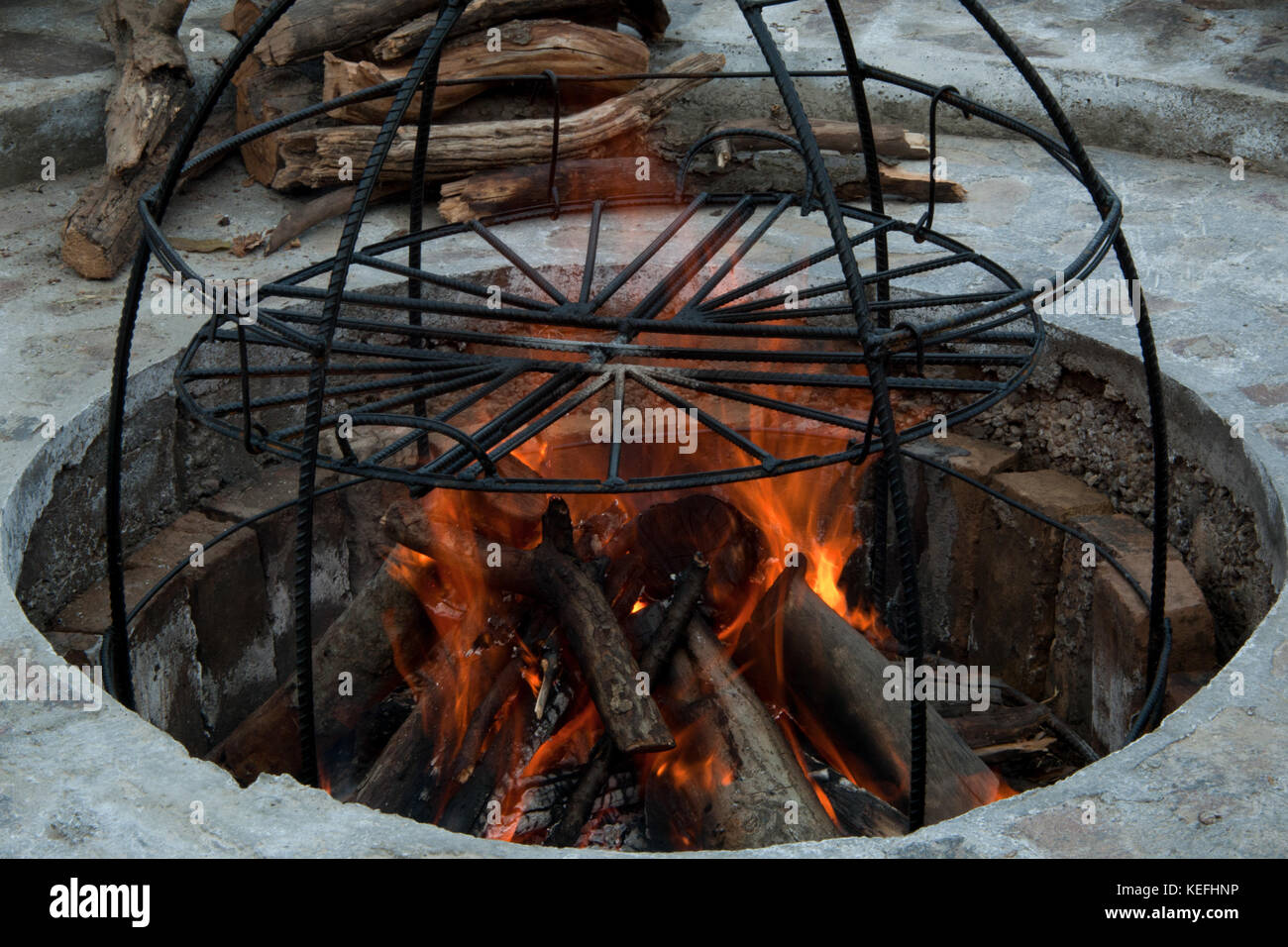 in the pit a construction of metal rods for smoke. metal structure for ...
