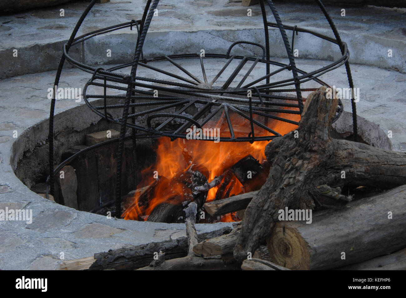 in the pit a construction of metal rods for smoke. metal structure for ...