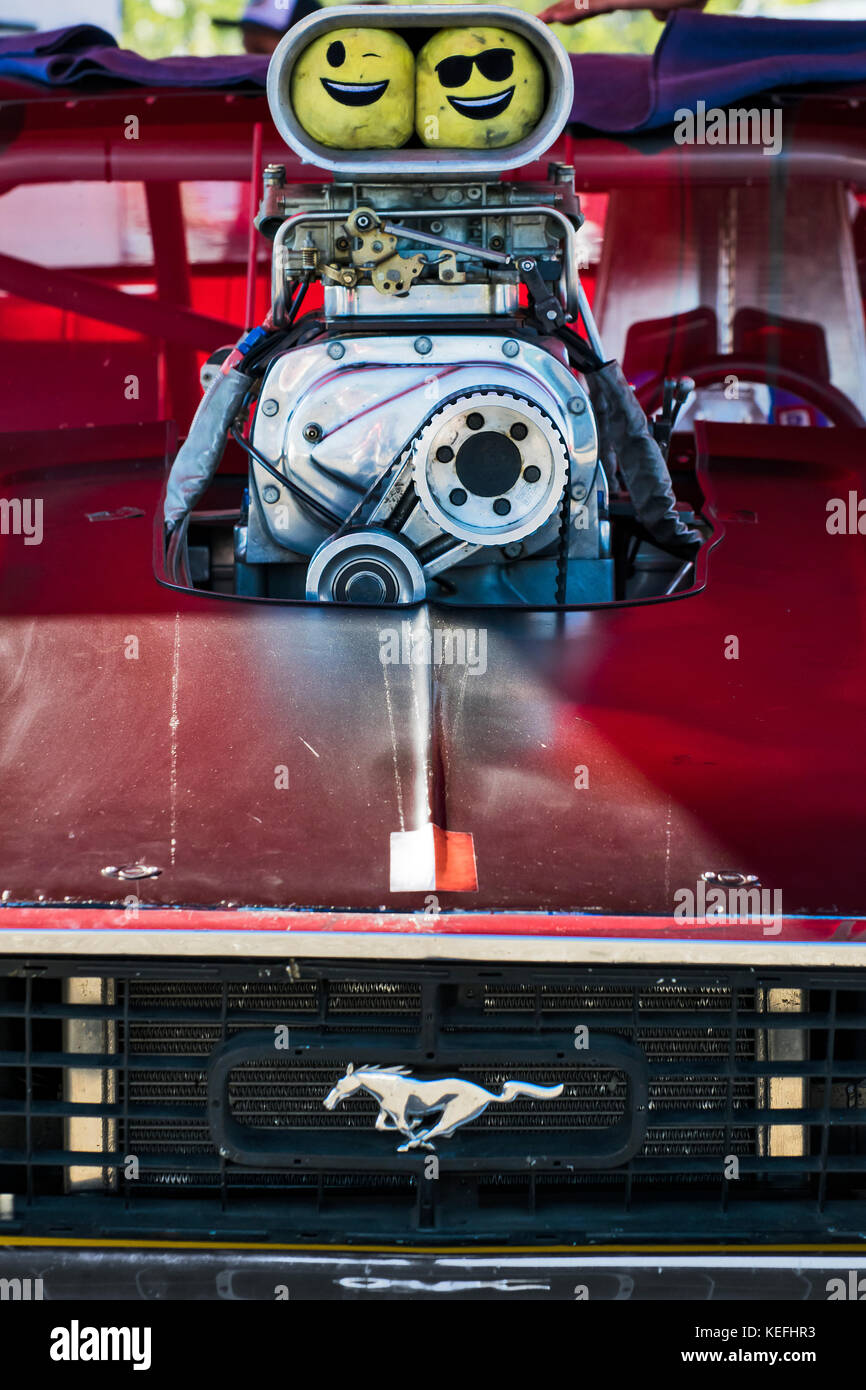 a frontal view of the engine of a dragster car at motor show in italy ...