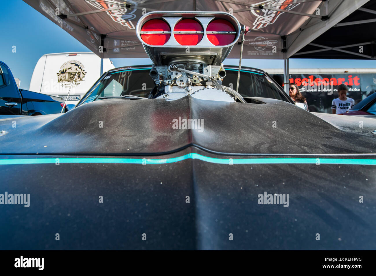 a close up view on a mustang engine coming out of the hood Stock Photo ...