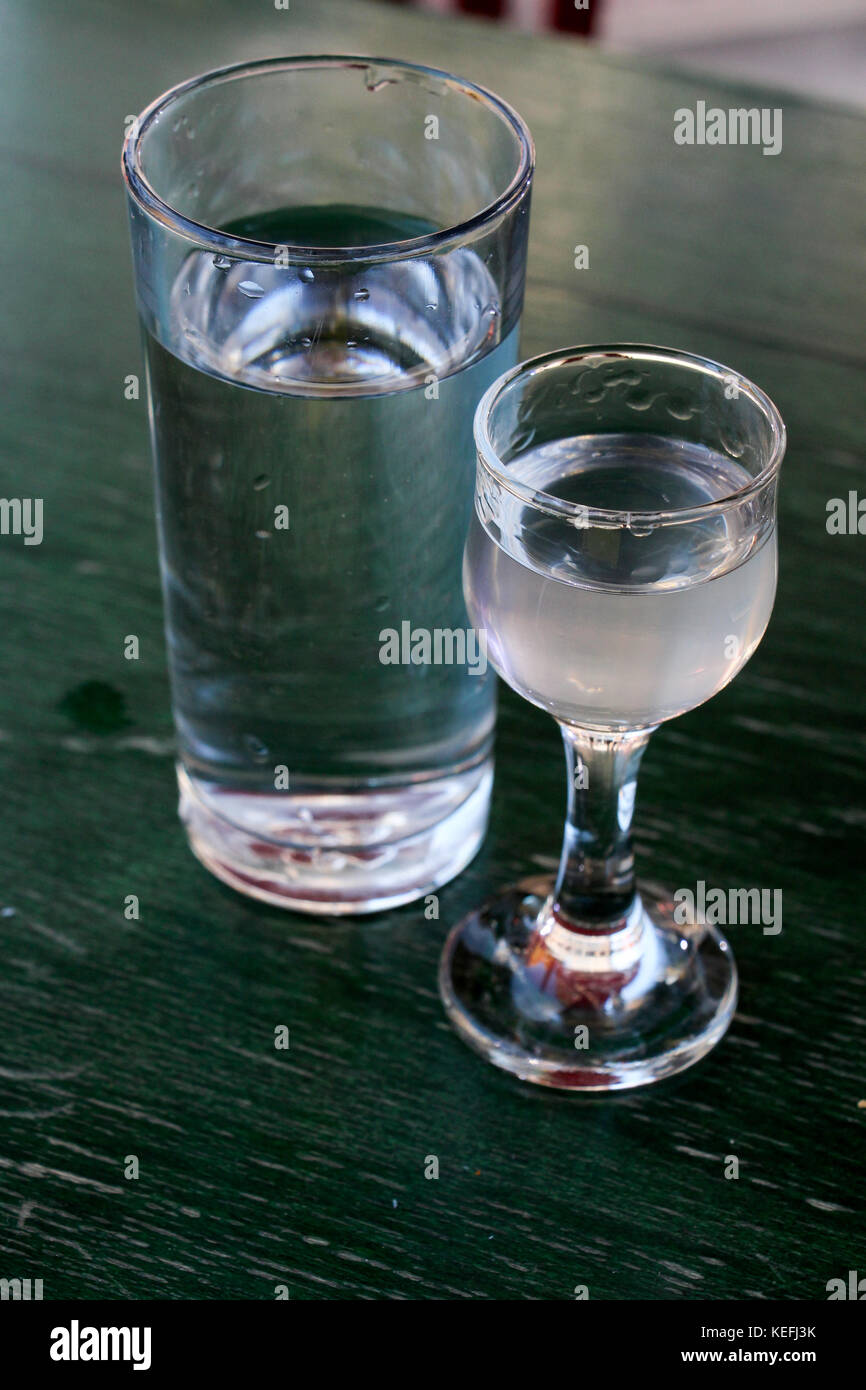cold served macedonian rakia and gass of water on a table,image Stock ...