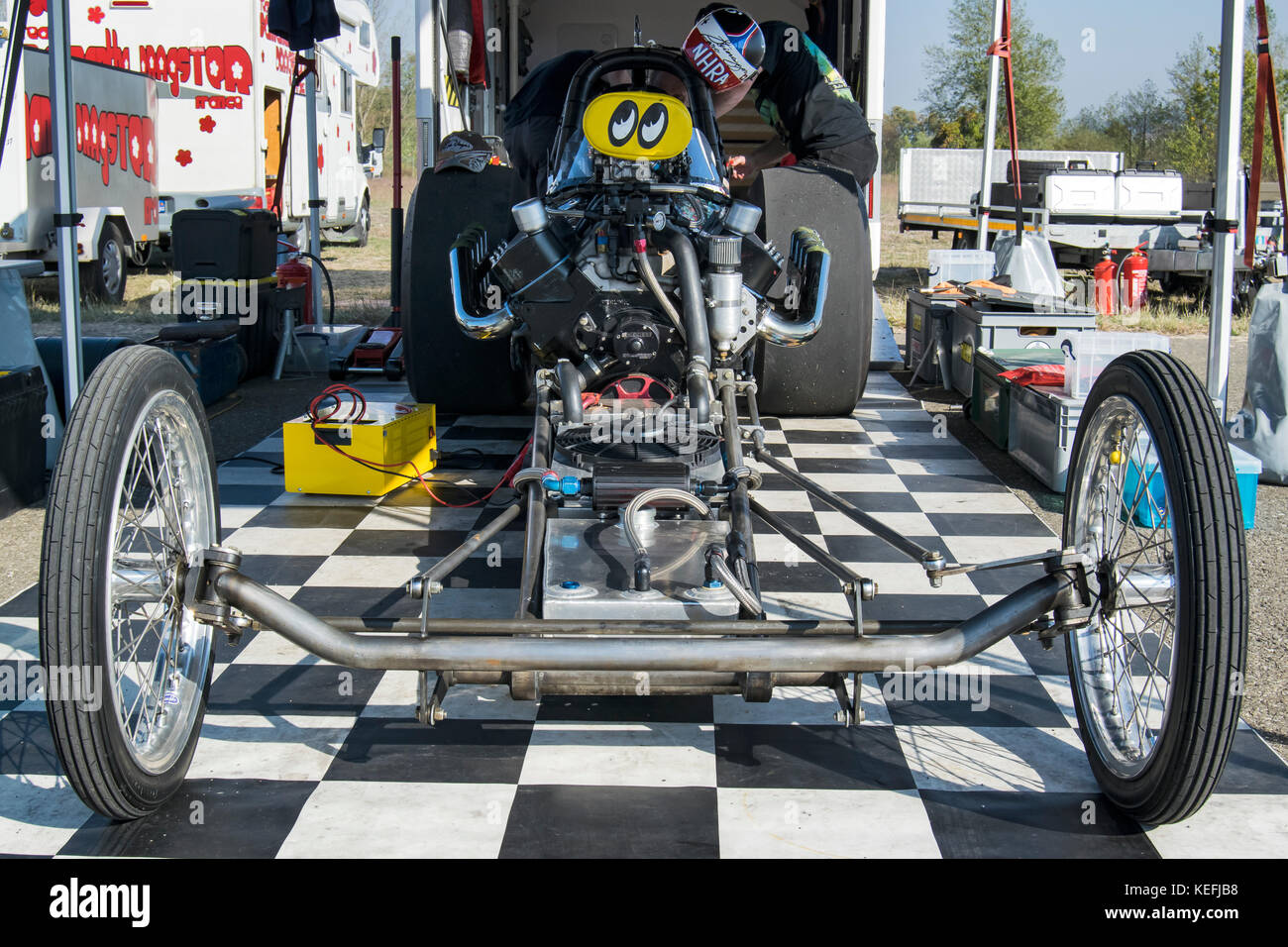 a frontal view of the engine of a dragster car at motor show in italy ...