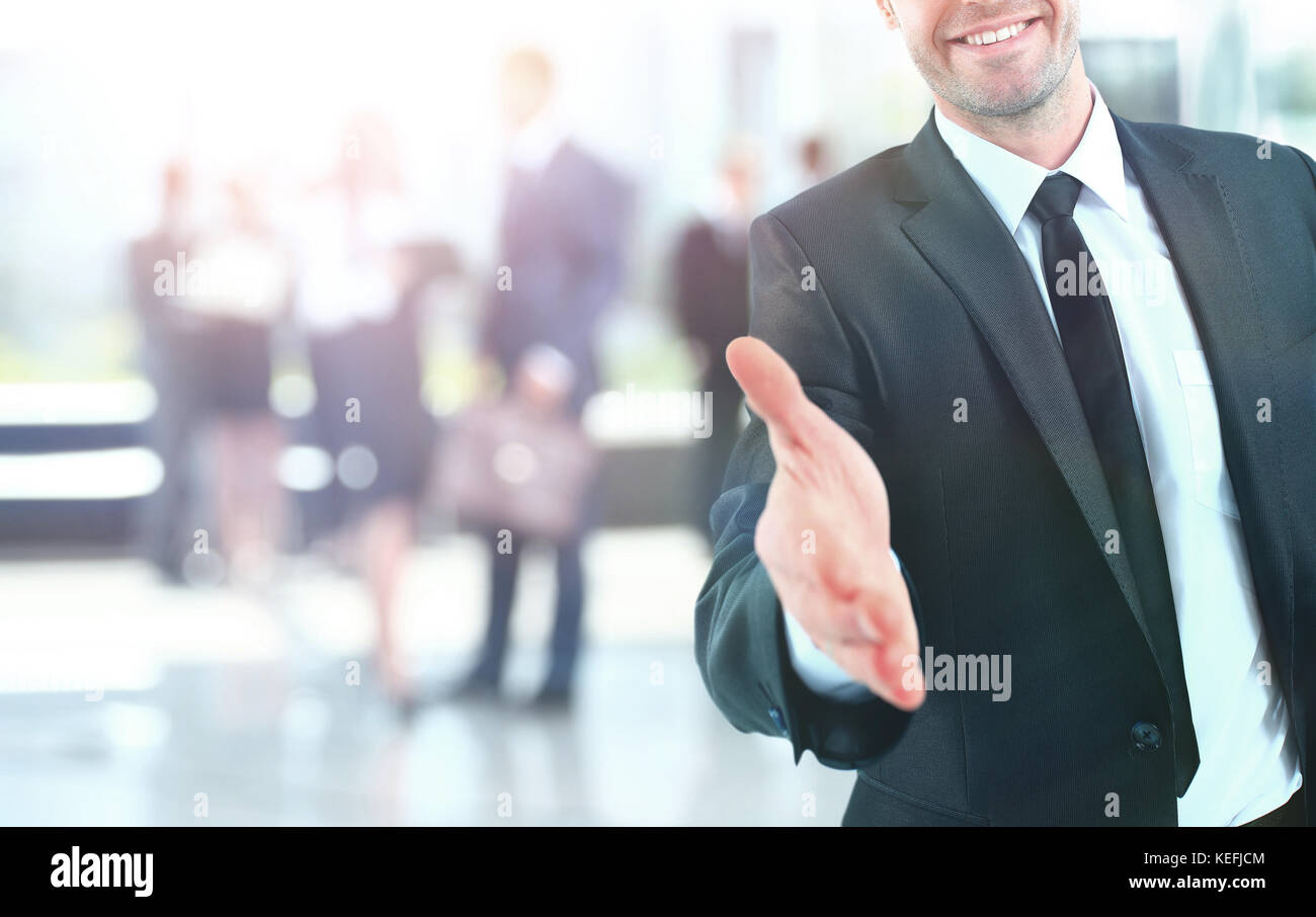 Portrait of a successful businessman giving a hand Stock Photo - Alamy