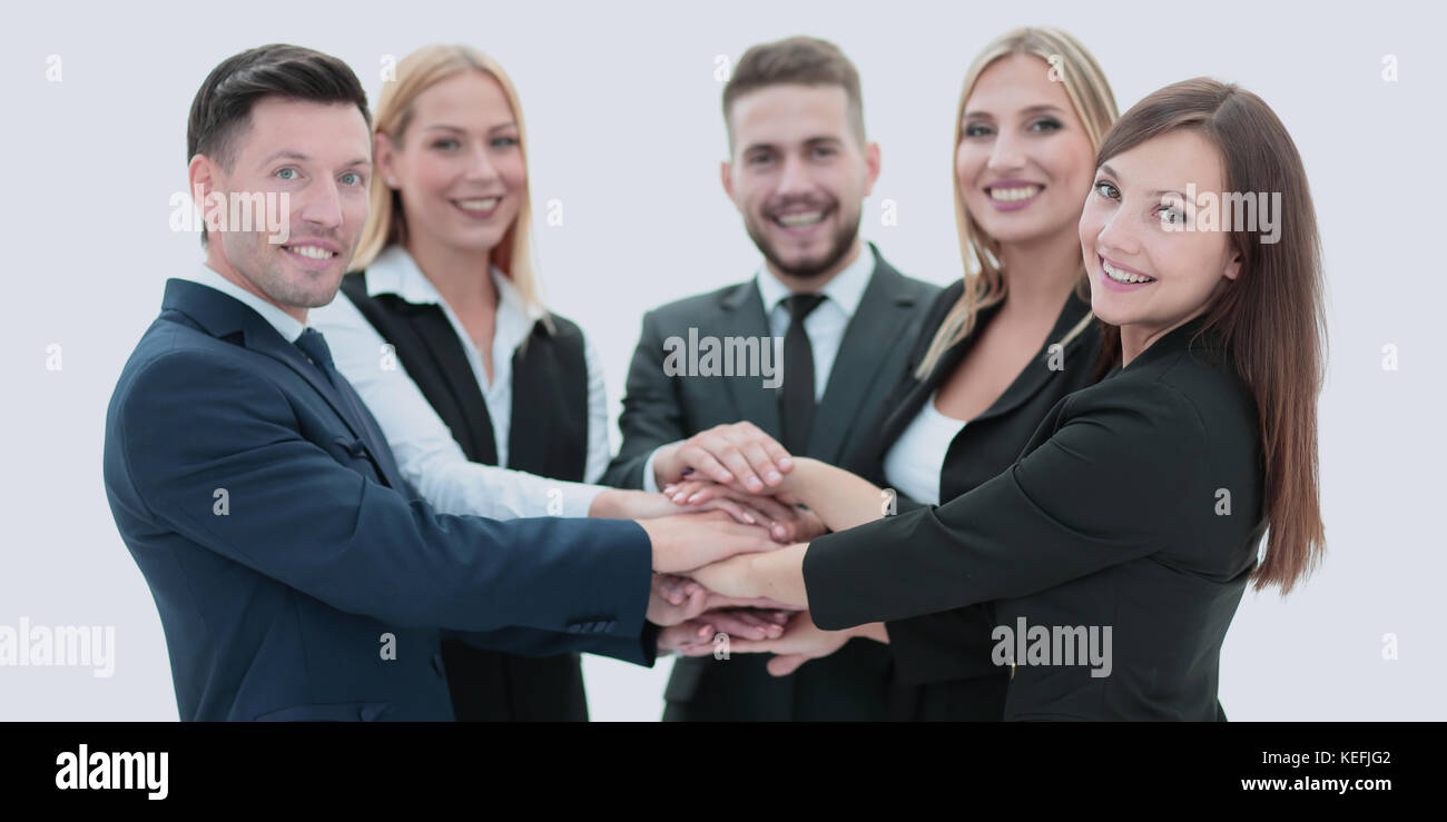 Business team showing unity with their hands together Stock Photo - Alamy