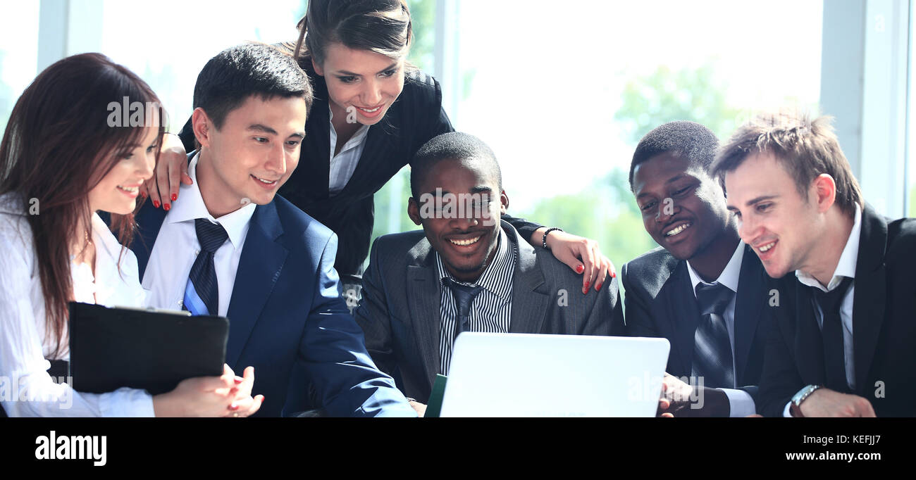 Happy working business team in modern office Stock Photo - Alamy