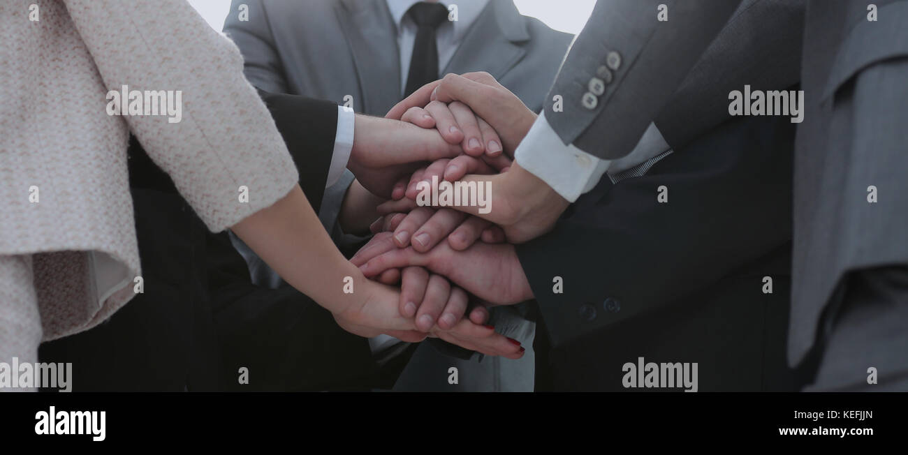 Close up top view of business people putting their hands together Stock ...