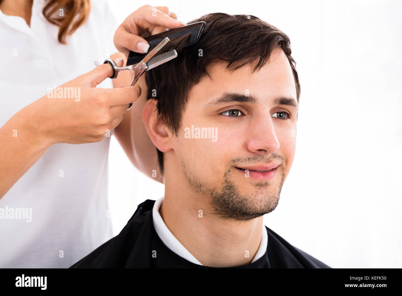 Close man getting haircut barber hi-res stock photography and images ...