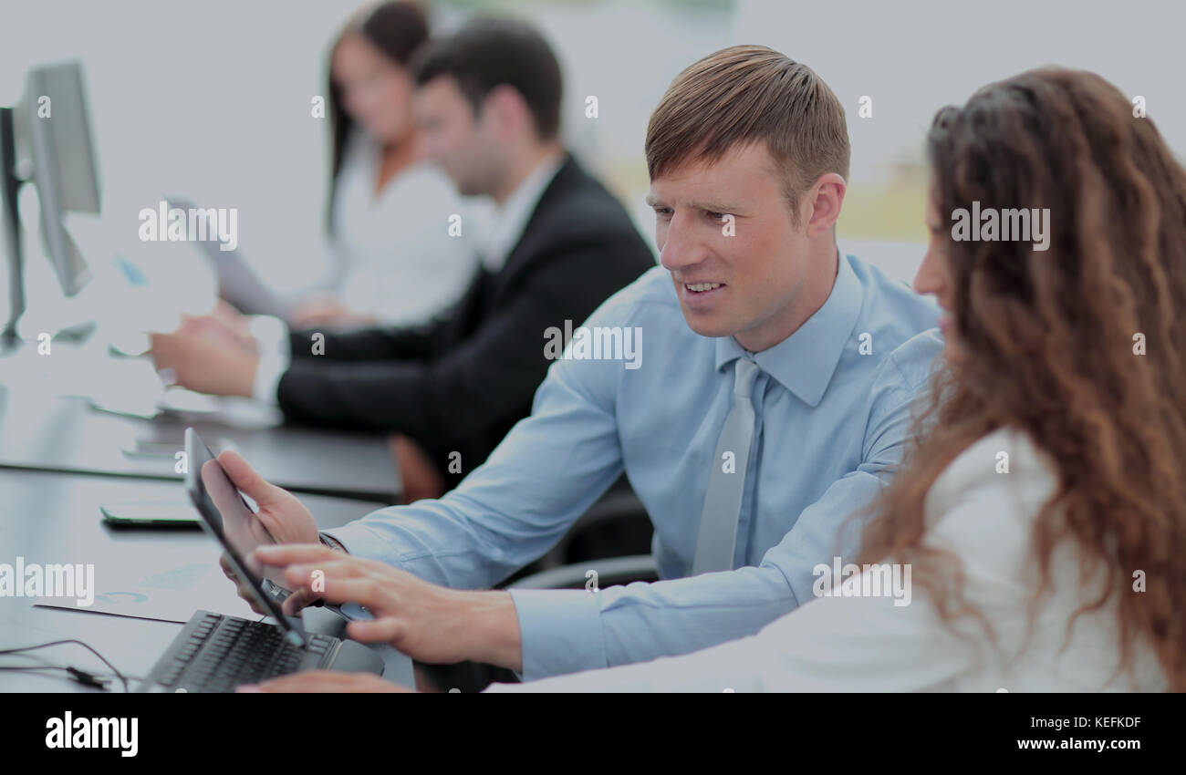 Business people working around table in modern office Stock Photo - Alamy