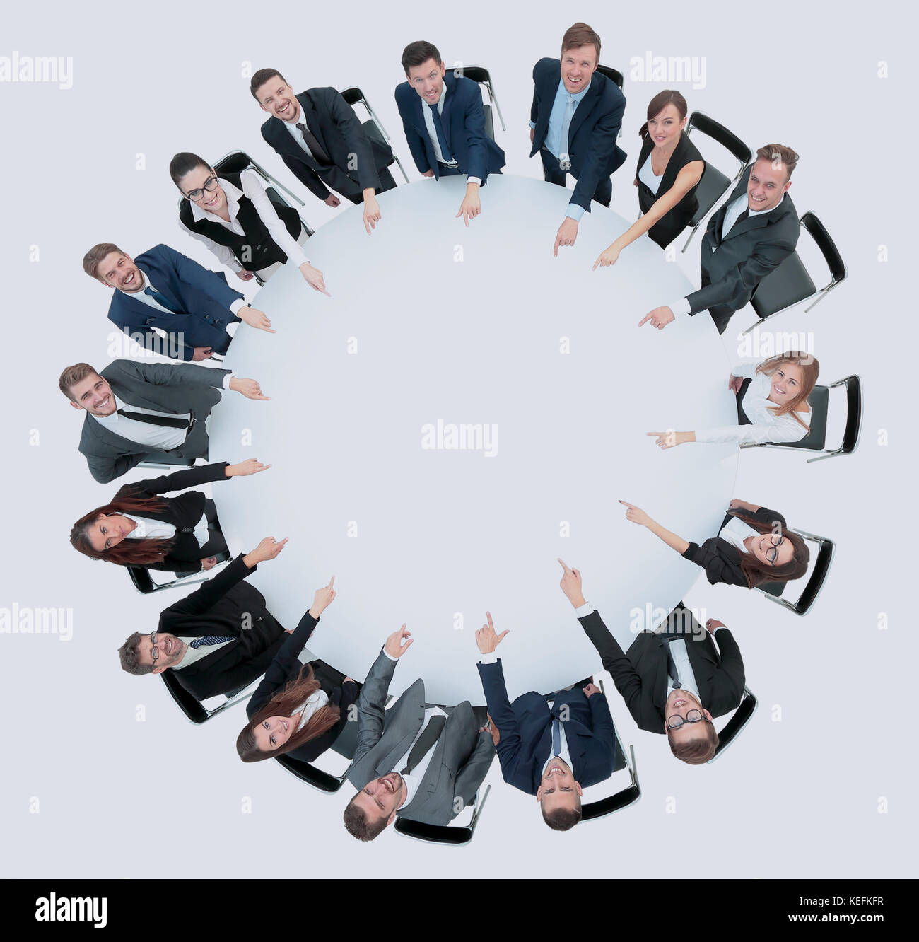 Happy business team pointing at something Stock Photo - Alamy