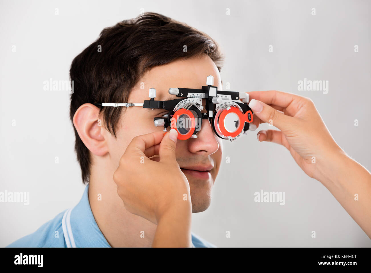 Close-up Of An Optometrist Checking Male Patient Vision With Trial ...