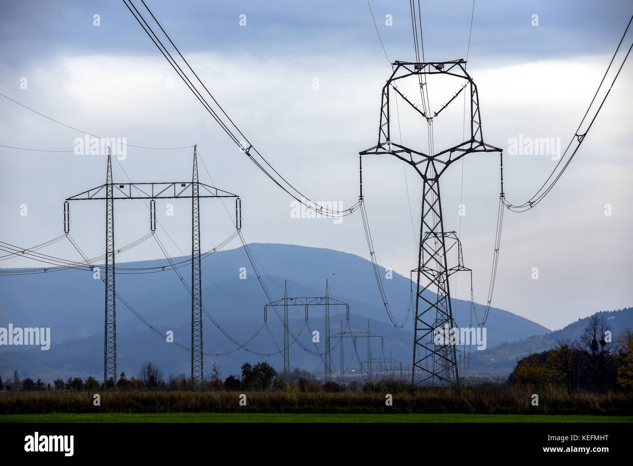 A PYLON AND HIGH-VOLTAGE POWER LINES, SKY Stock Photo - Alamy