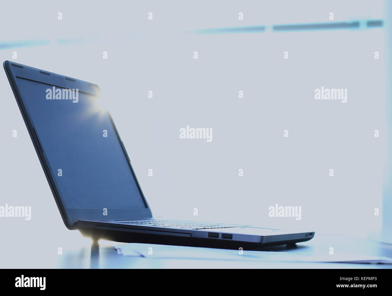 morning in the office. laptop on the table Stock Photo - Alamy