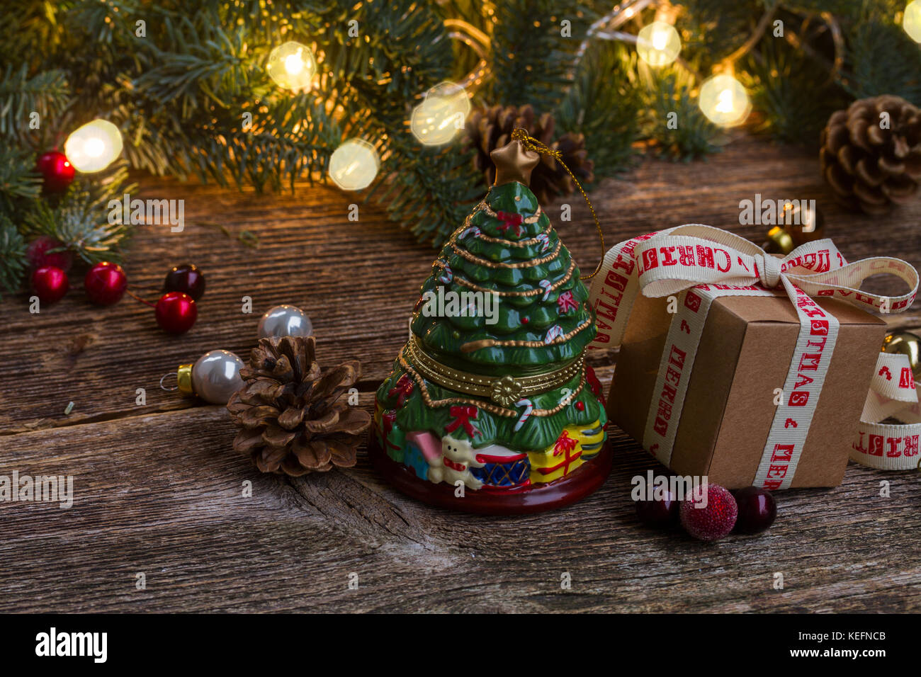 One handmade present box with evergreen tree twigs close up on wooden ...