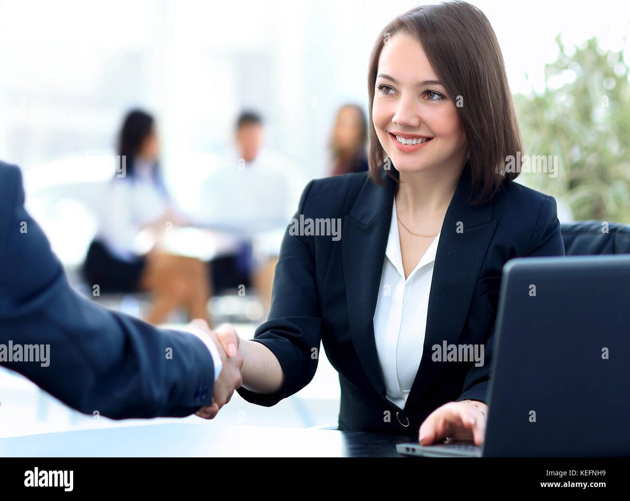 close-up of a handshake of a Manager and customer in the workplace ...