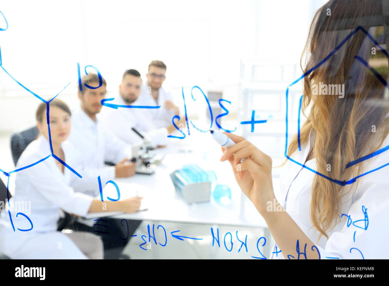 female scientist makes a report to colleagues Stock Photo - Alamy