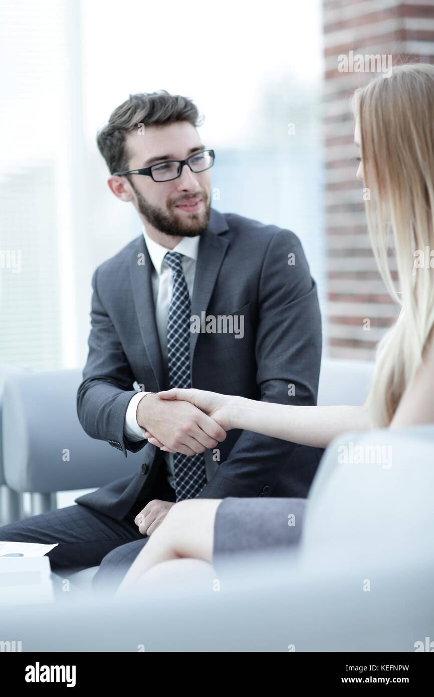 close-up of a manager shakes hands with a regular customer Stock Photo ...