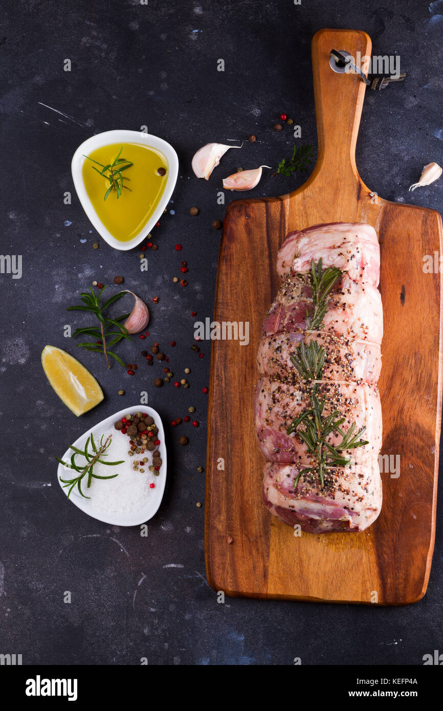 Raw lamb roll with spices on dark background Stock Photo - Alamy