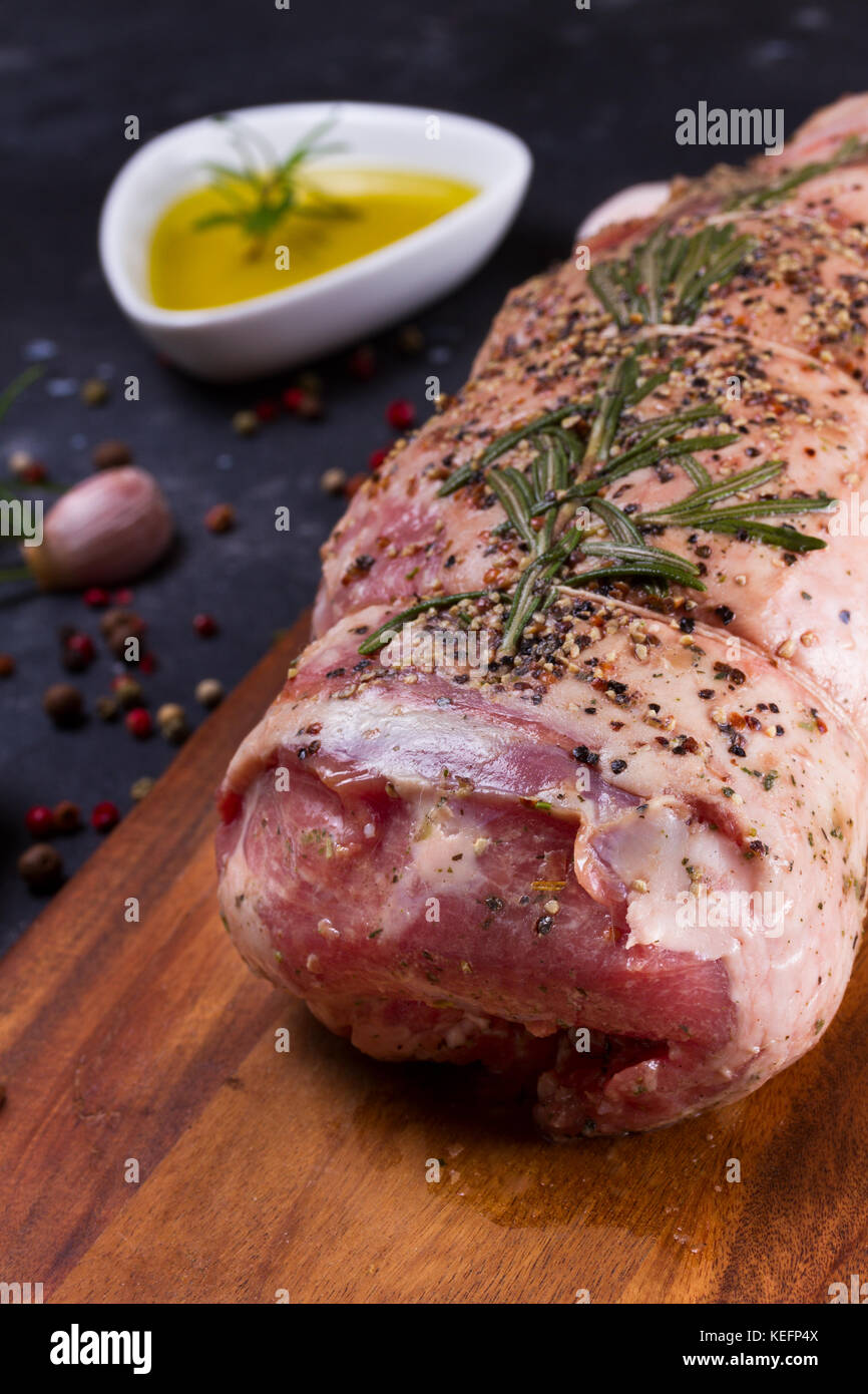 Raw lamb roll with spices on dark background Stock Photo - Alamy