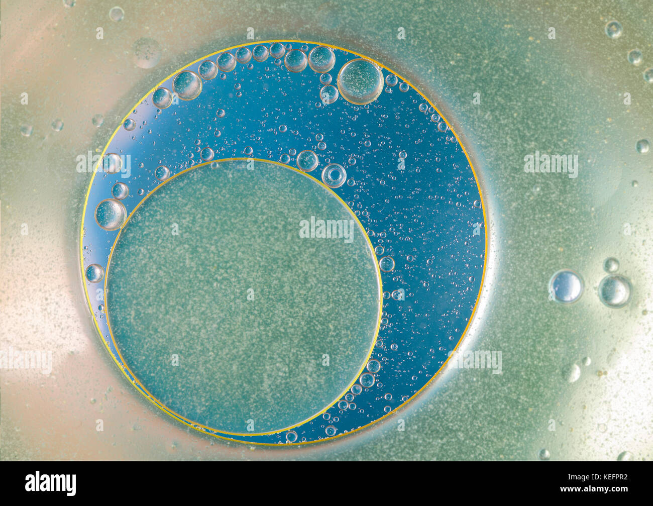 crescent shape oil drop on water Stock Photo - Alamy