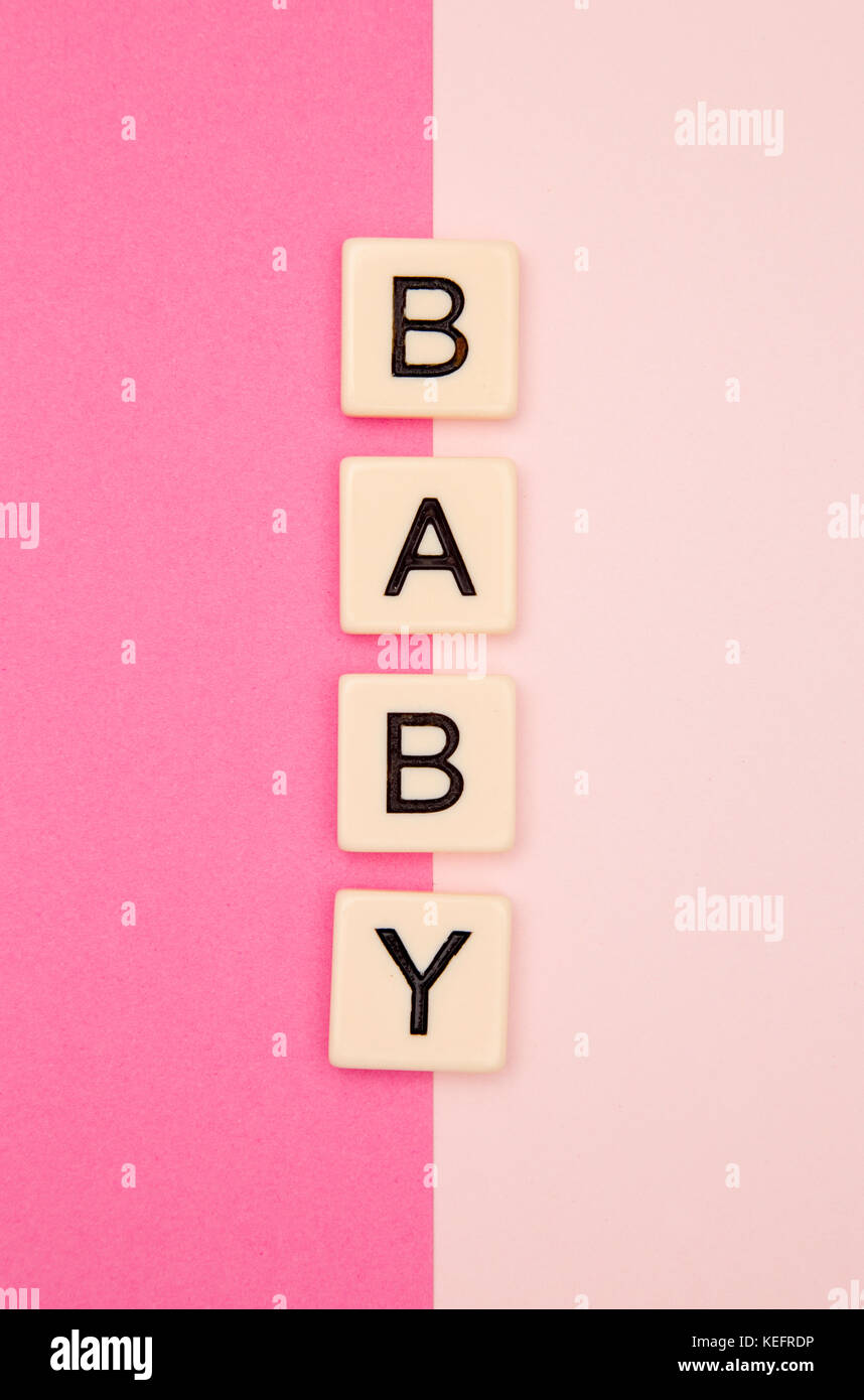 Baby Spelled Out on a Pink Background Stock Photo - Alamy