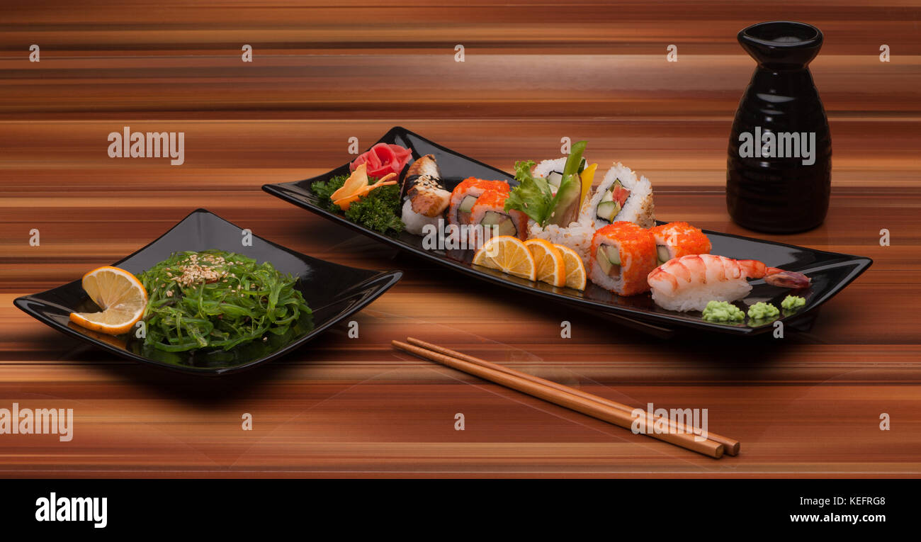 assortment of sushi in black square plate Stock Photo - Alamy