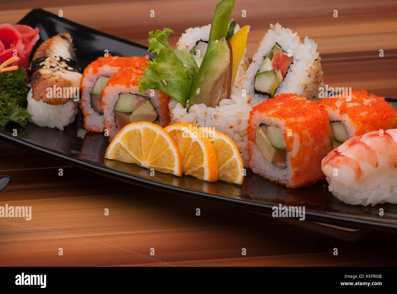 assortment of sushi in black square plate Stock Photo - Alamy